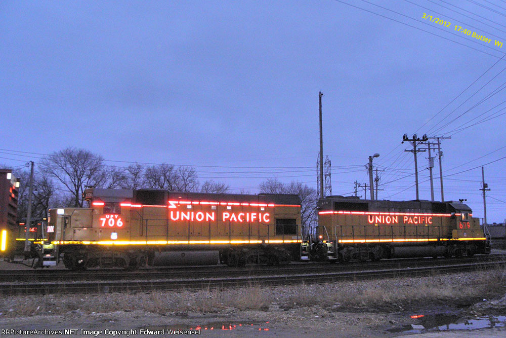 UP 679 and UY 706 flash the snowmelt puddle